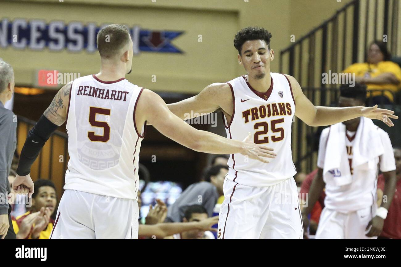 USC forward Bennie Boatwright (25) high-five with guard Katin Reinhardt ...