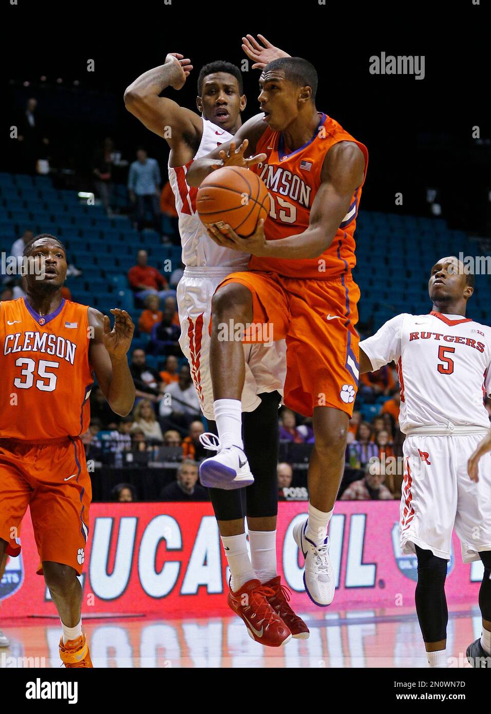 Clemson forward Donte Grantham shoots next to Rutgers forward Greg ...