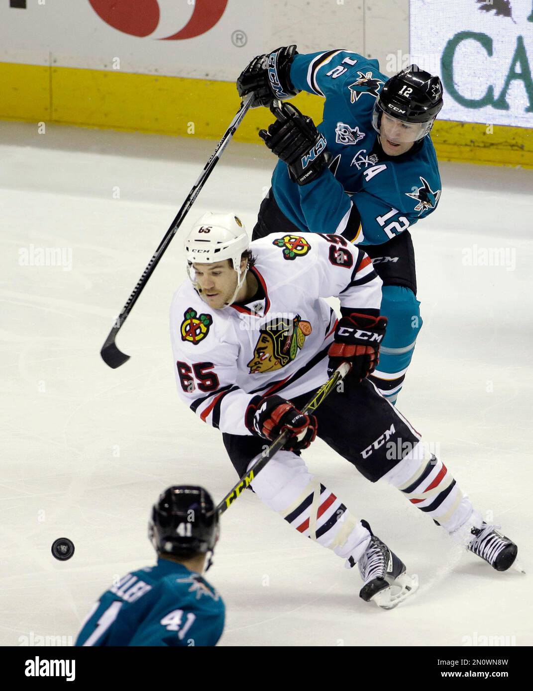 Chicago Blackhawks' Andrew Shaw (65) works against San Jose Sharks ...