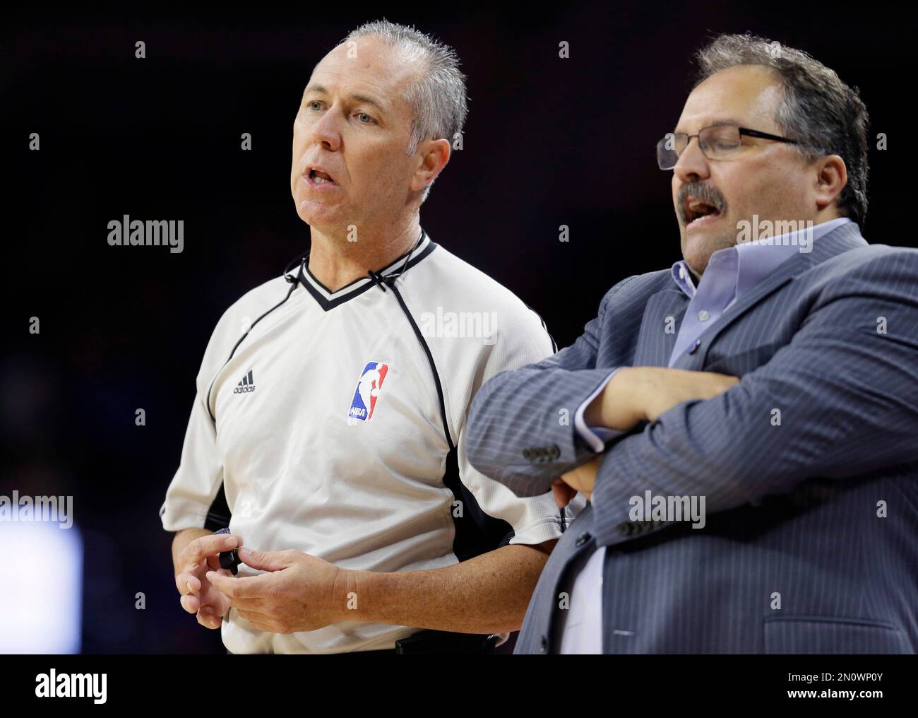 Referee Jason Phillips talks to Detroit Pistons head coach Stan Van ...