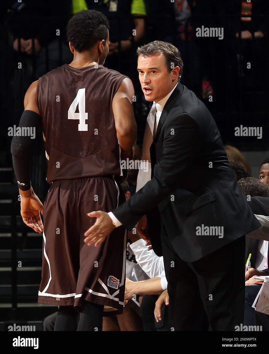 Lehigh head coach Brett Reed greets Lehigh guard Devon Carter (4) at ...