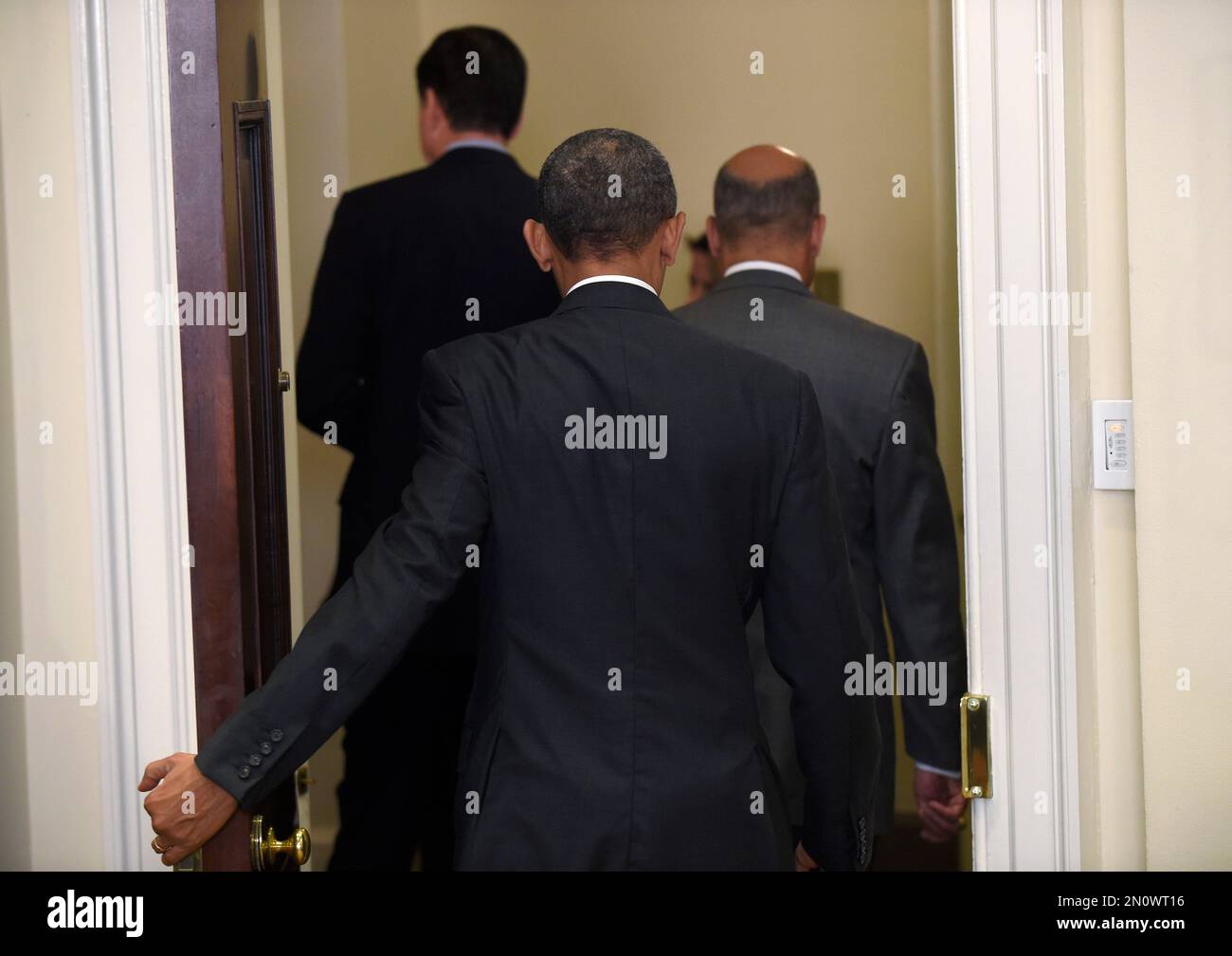 President Barack Obama follows Homeland Security Secretary Jeh Johnson ...