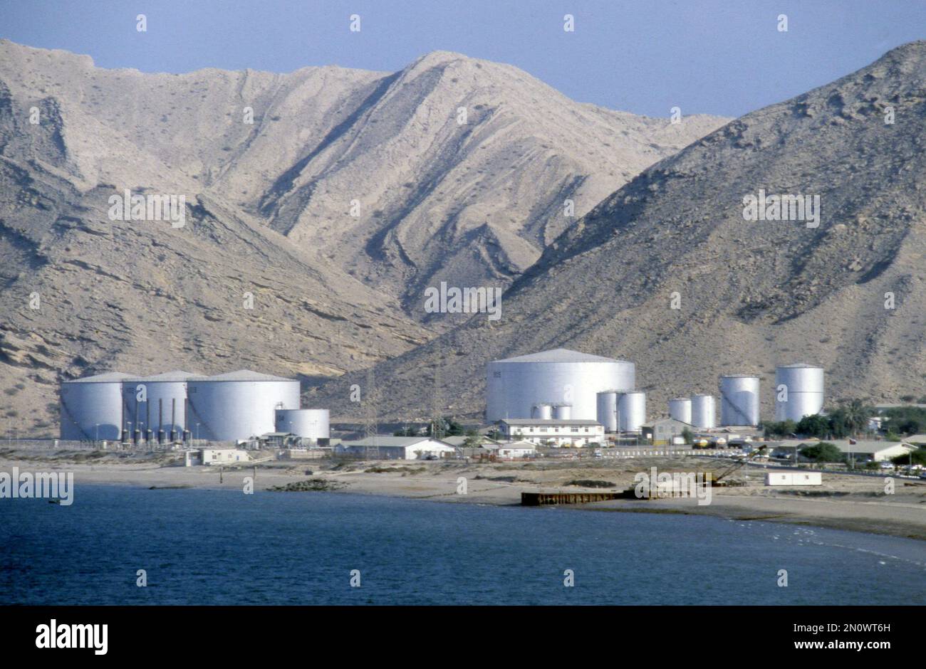 Oil storage tanks on the waterfront in Muscat, Oman, in 1980. (Bill ...