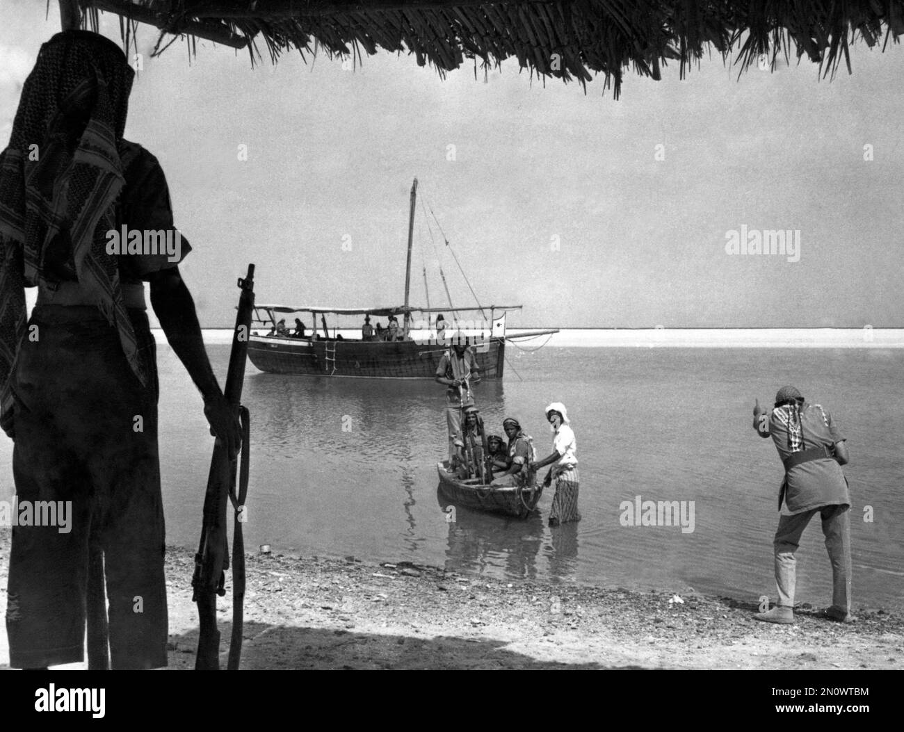 Arab soldiers of the Trucial Oman Scouts, armed with rifles, prepare to ...