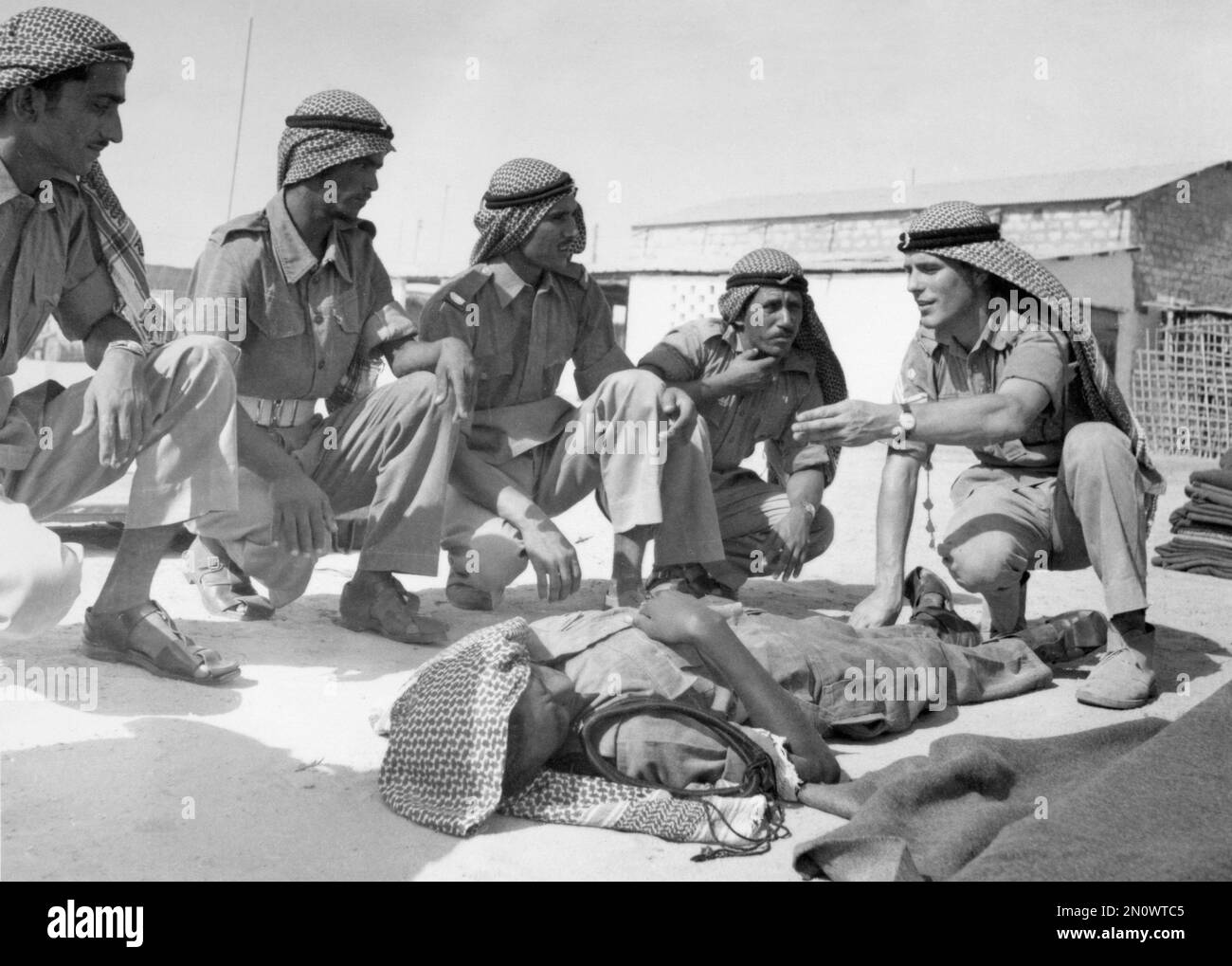 Arab soldiers of the famed Trucial Oman Scouts are briefed on the ...