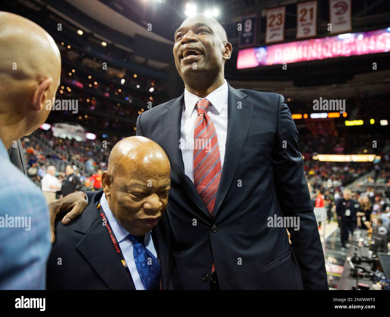 Former Atlanta Hawks' Dikembe Mutombo, right, talks with U.S. Rep. John ...