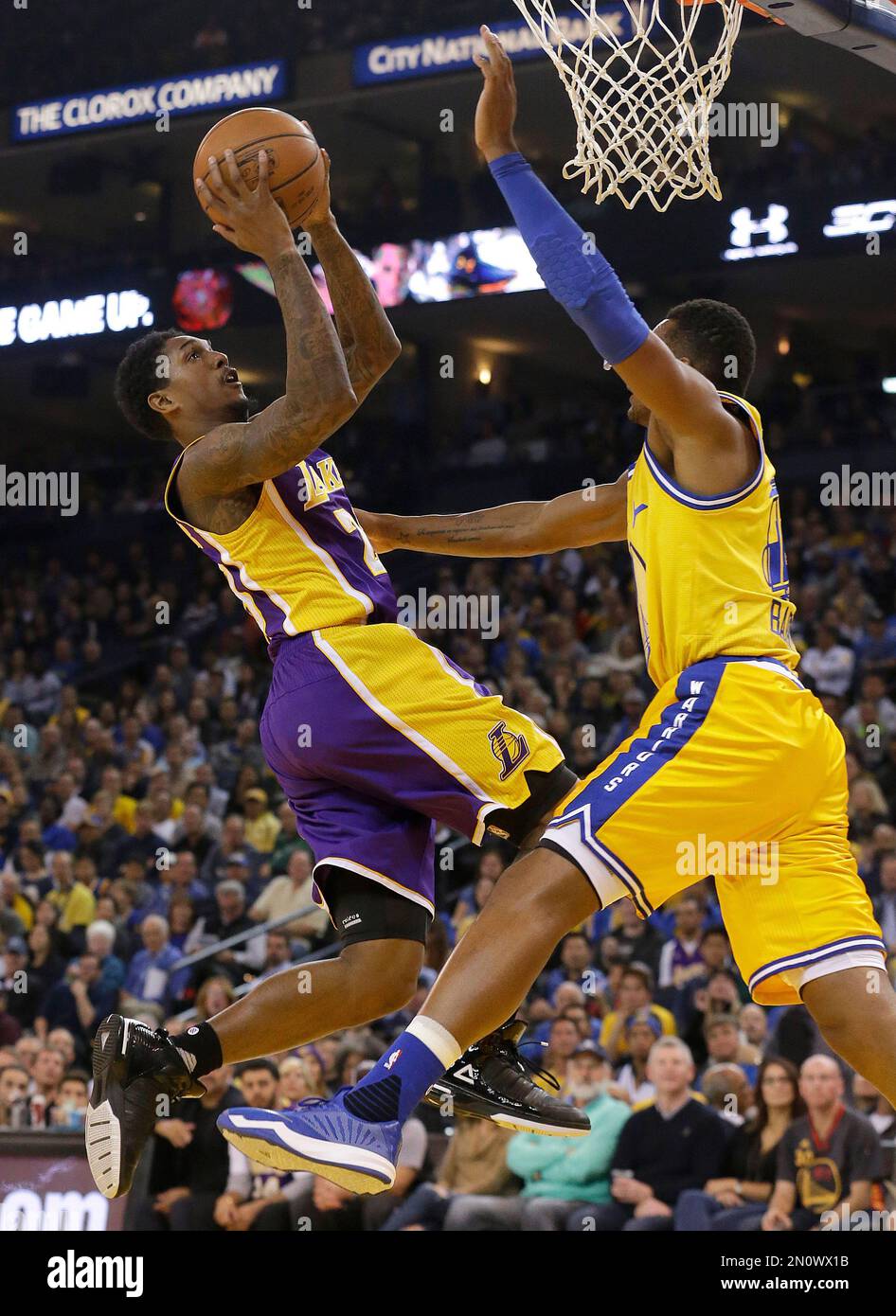 Los Angeles Lakers guard Lou Williams, left, shoots against Golden ...