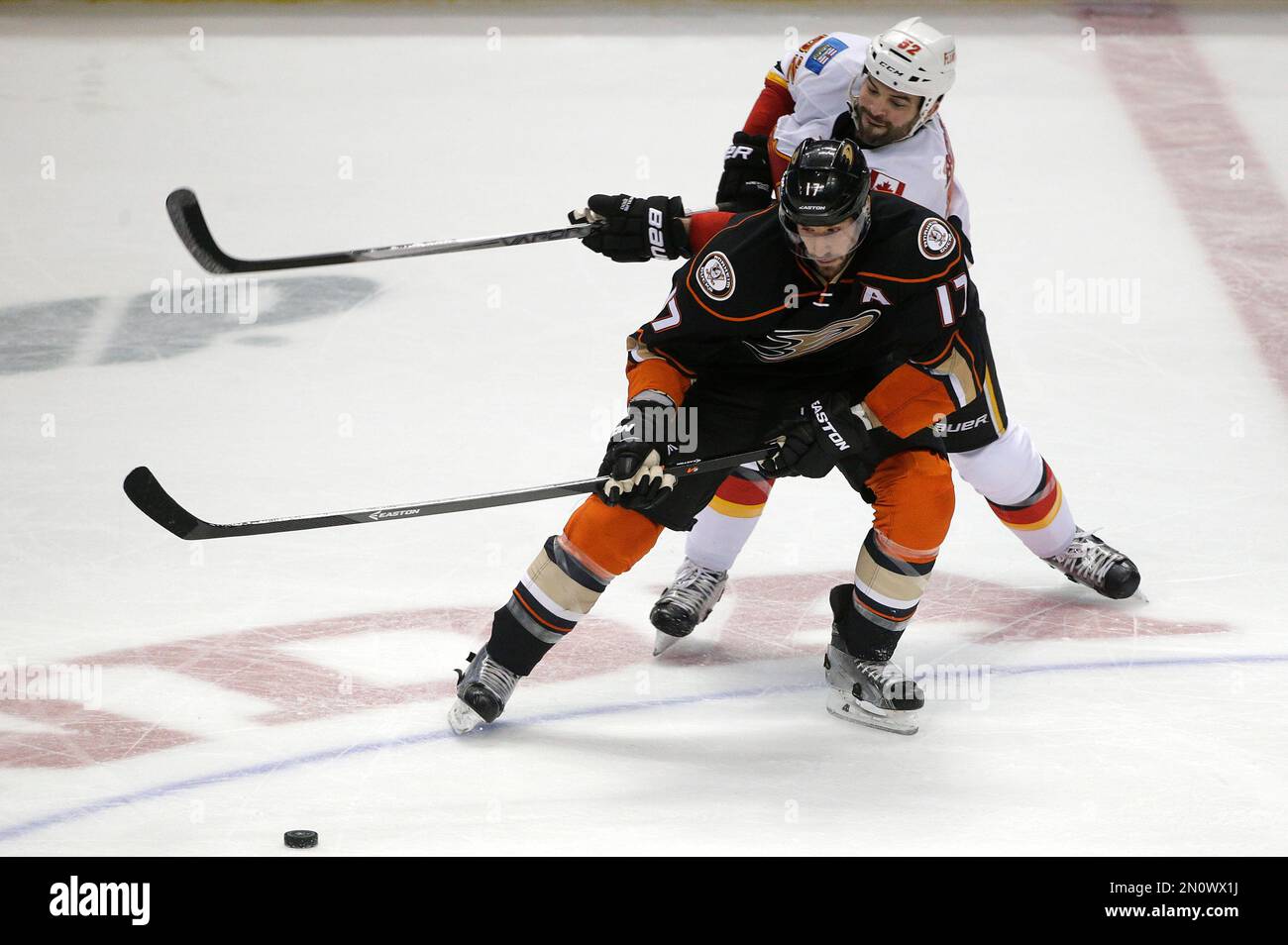 Anaheim Ducks' Ryan Kesler, front, is pressured by Calgary Flames ...