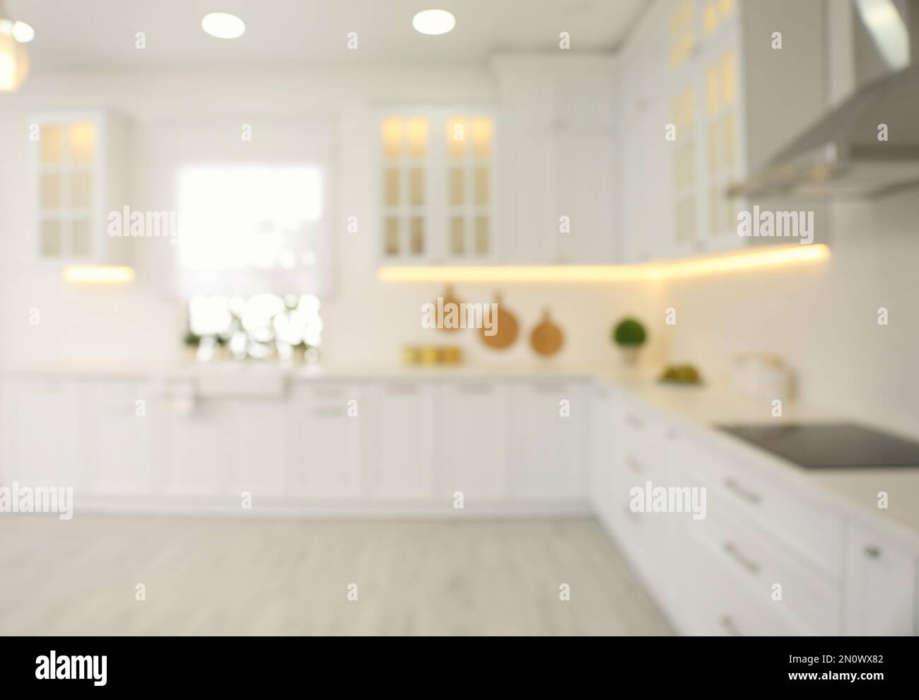 Blurred view of modern kitchen interior with stylish furniture Stock ...