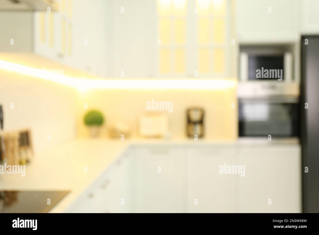 Blurred view of modern kitchen interior with stylish furniture Stock ...