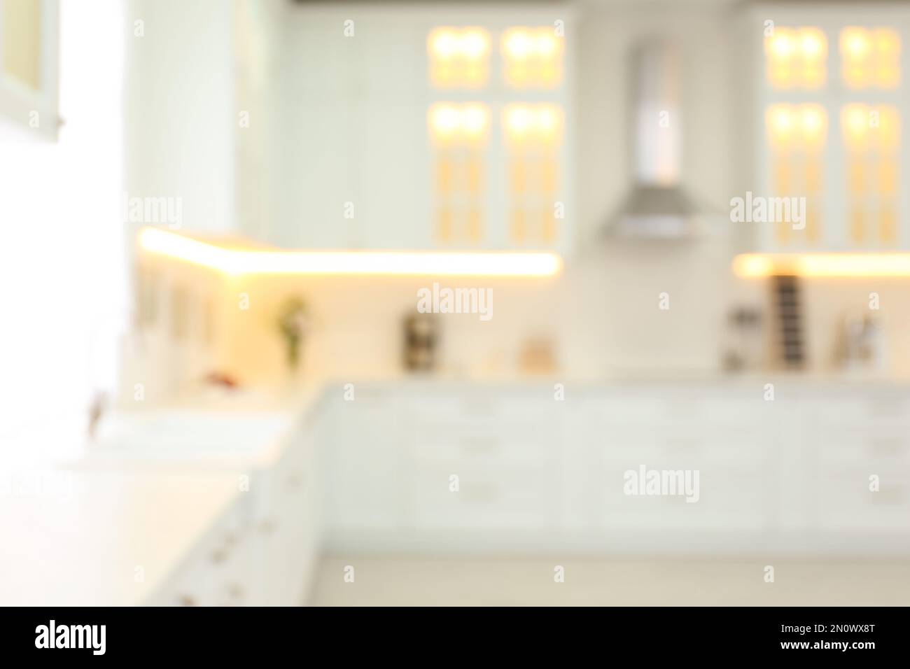 Blurred view of modern kitchen interior with stylish furniture Stock ...
