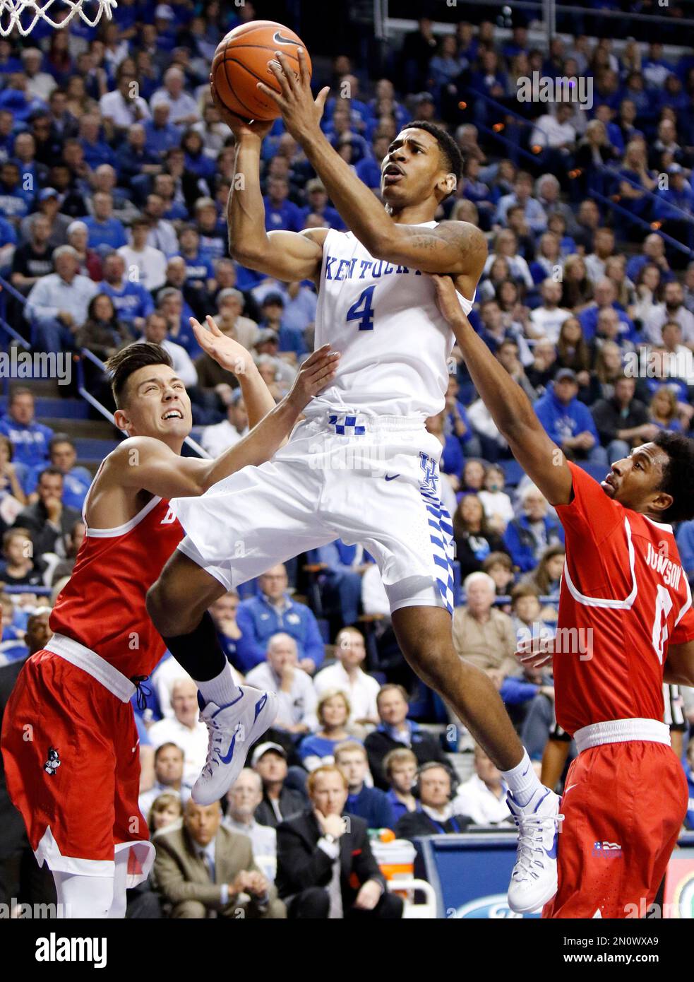 Kentucky's Charles Matthews (4) shoots between Boston University's Nick ...