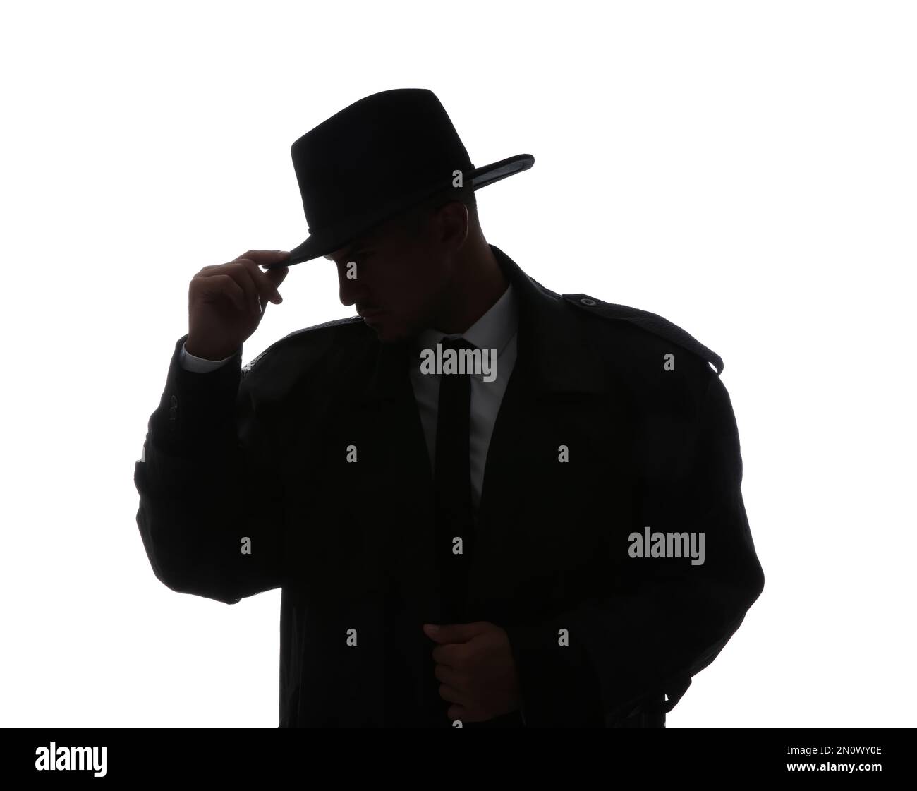 Old fashioned detective in hat on white background Stock Photo - Alamy