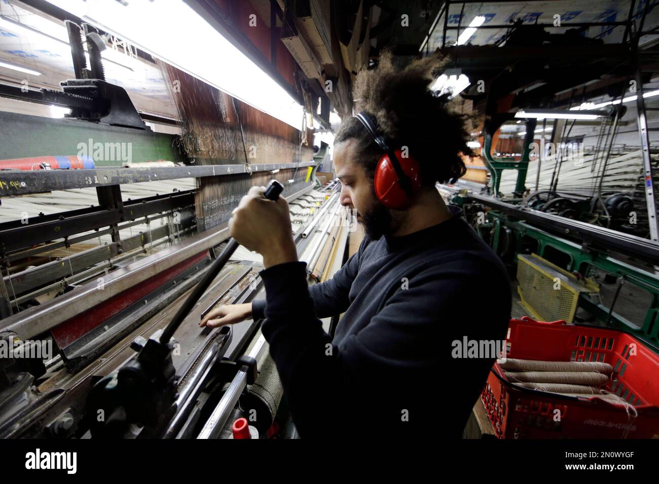 Ronald Vargas works on a loom Monday, Nov. 23, 2015, at Langhorne ...