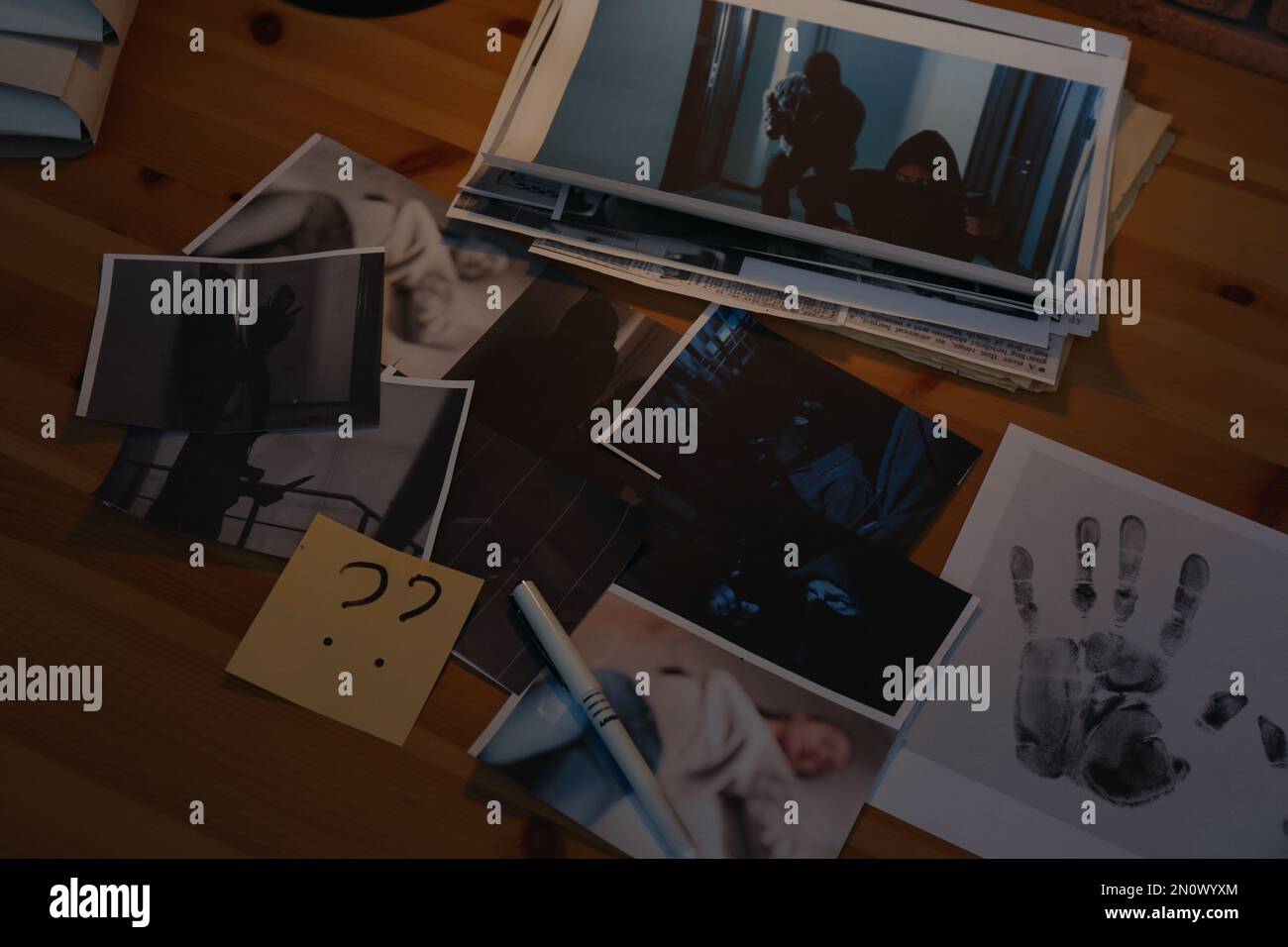 Fingerprints and crime scene photos on table. Detective agency Stock ...