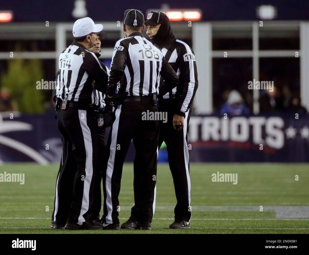 Referee Gene Steratore, left, confers with back judge Dino Paganelli ...