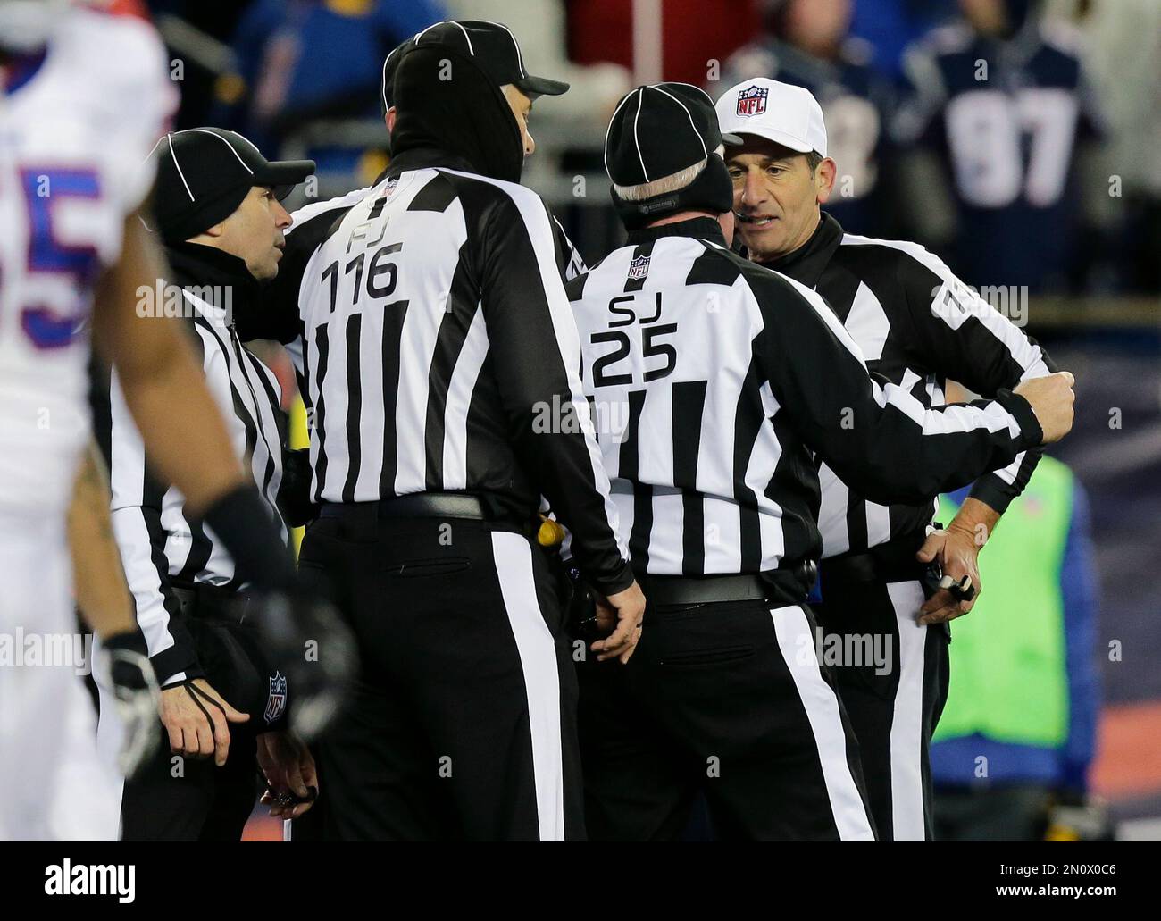 Back judge Dino Paganelli, left, field judge Mike Weatherford (116) and ...