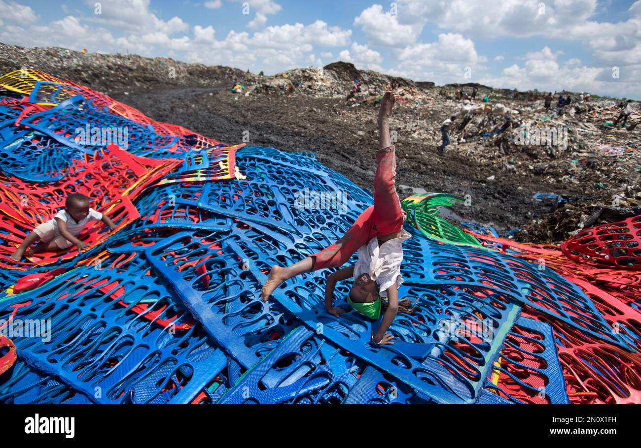 In this photo taken Thursday, Nov. 12, 2015, Joyce Njeri, 8, enjoys a ...