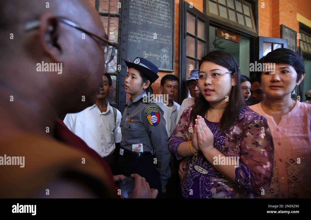 Student Chaw Sandi Tun, 25, speaks with a Buddhist monk after her ...