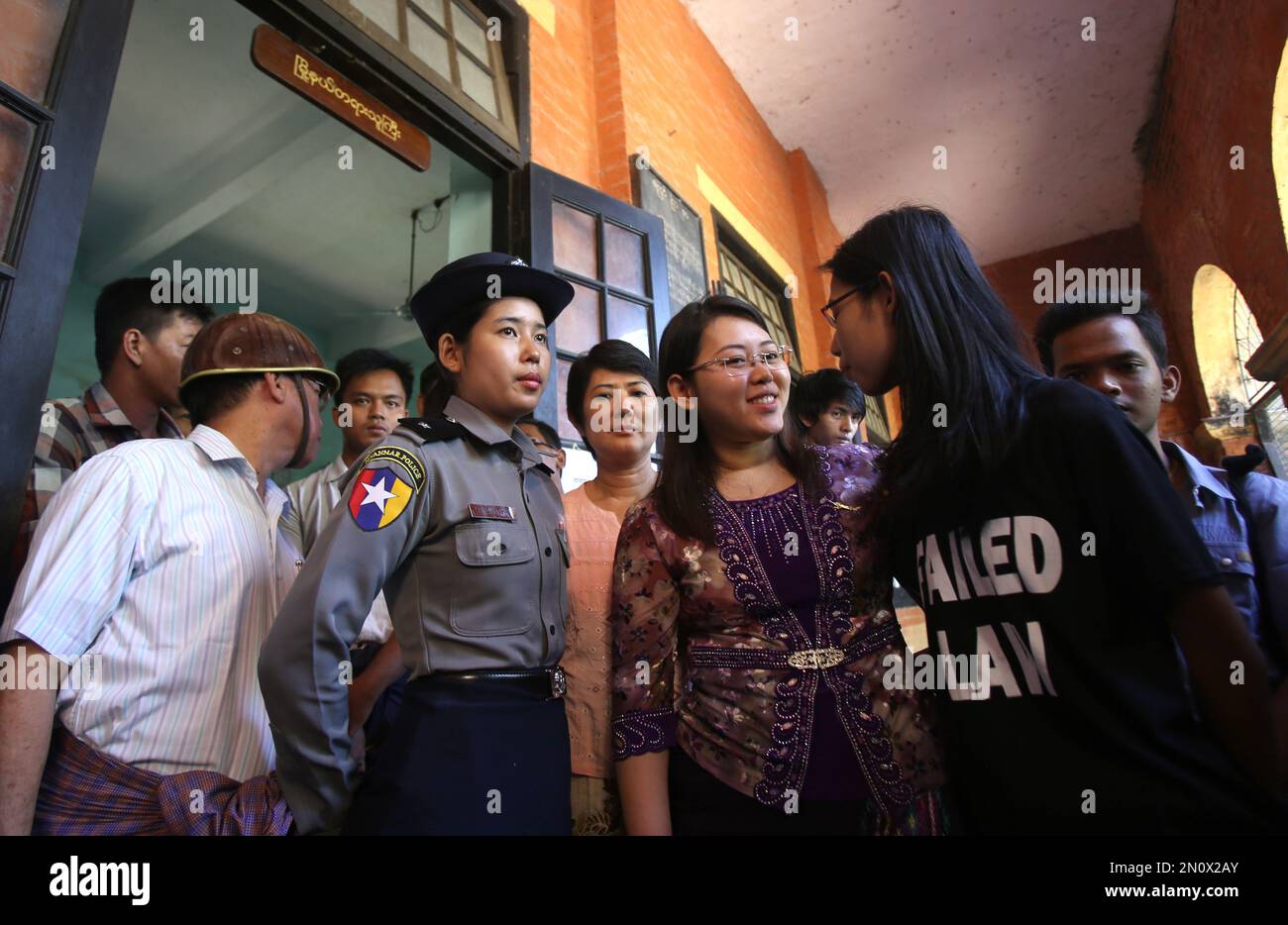Student Chaw Sandi Tun, 25, speaks with her friend May Thazin Hnin ...