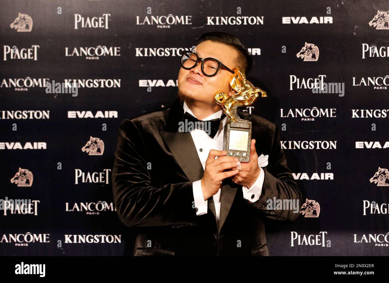 Hong Kong Actor Michael Ning holds his award for Best Supporting Actor ...