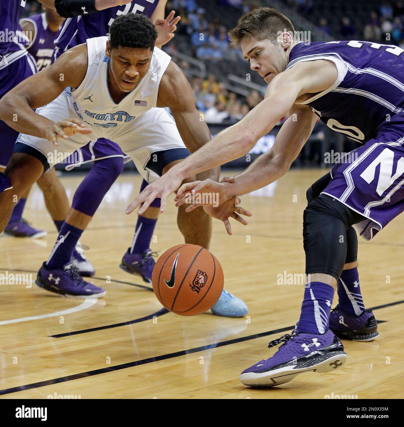 North Carolina's Isaiah Hicks, left, and Northwestern's Bryant McIntosh ...