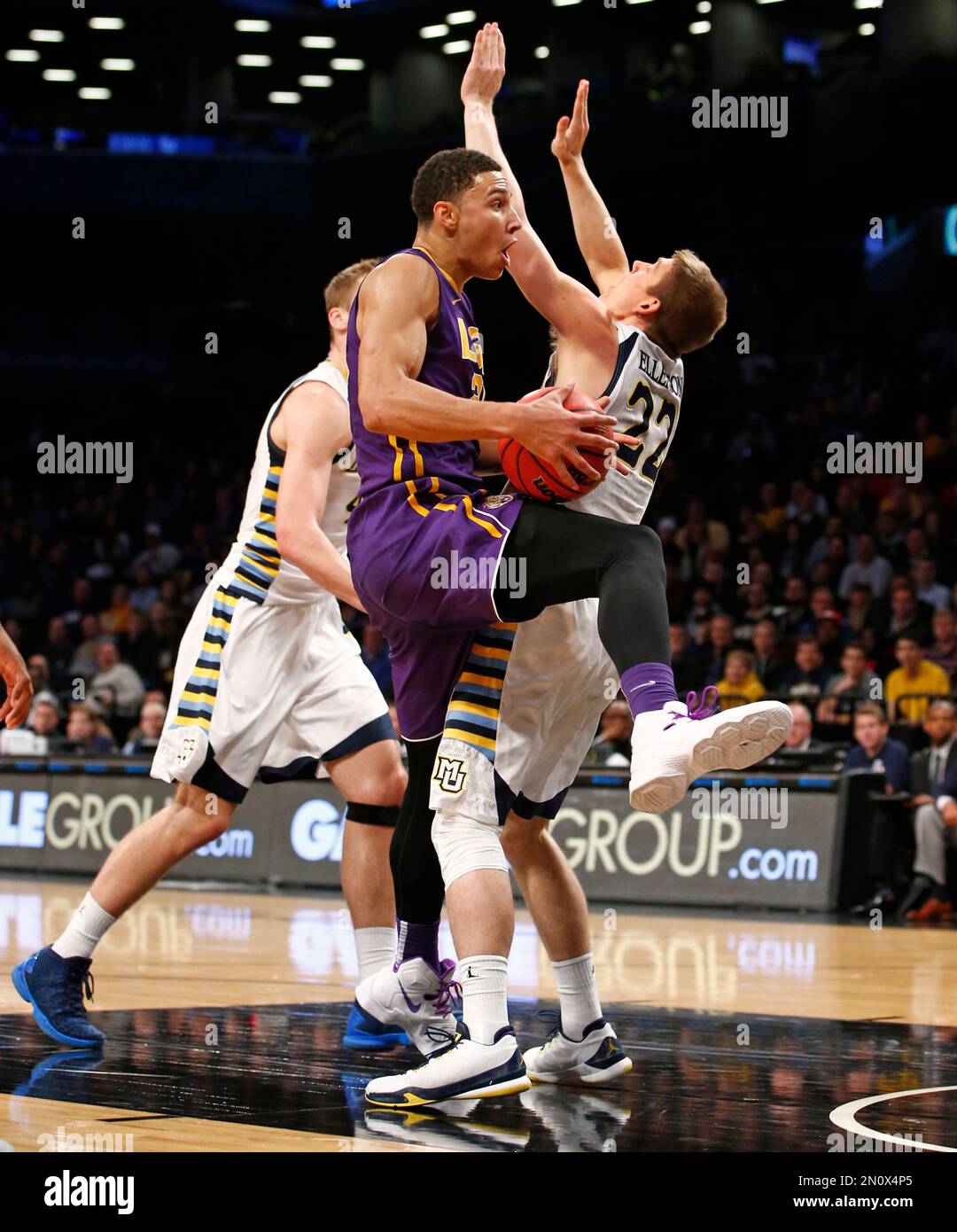 LSU forward Ben Simmons (25) collides with Marquette guard Wally ...
