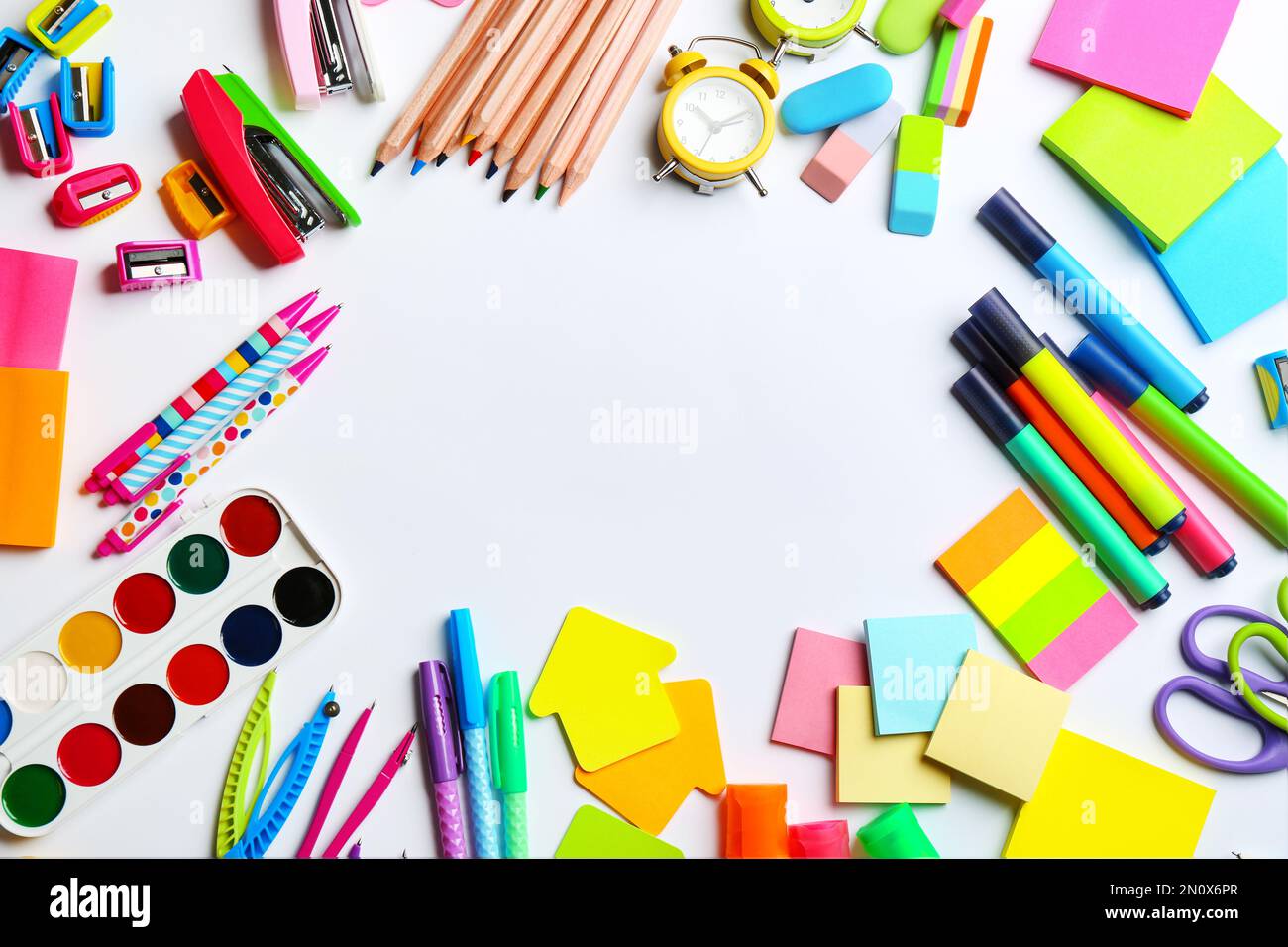 Frame made of school stationery on white background, flat lay with ...