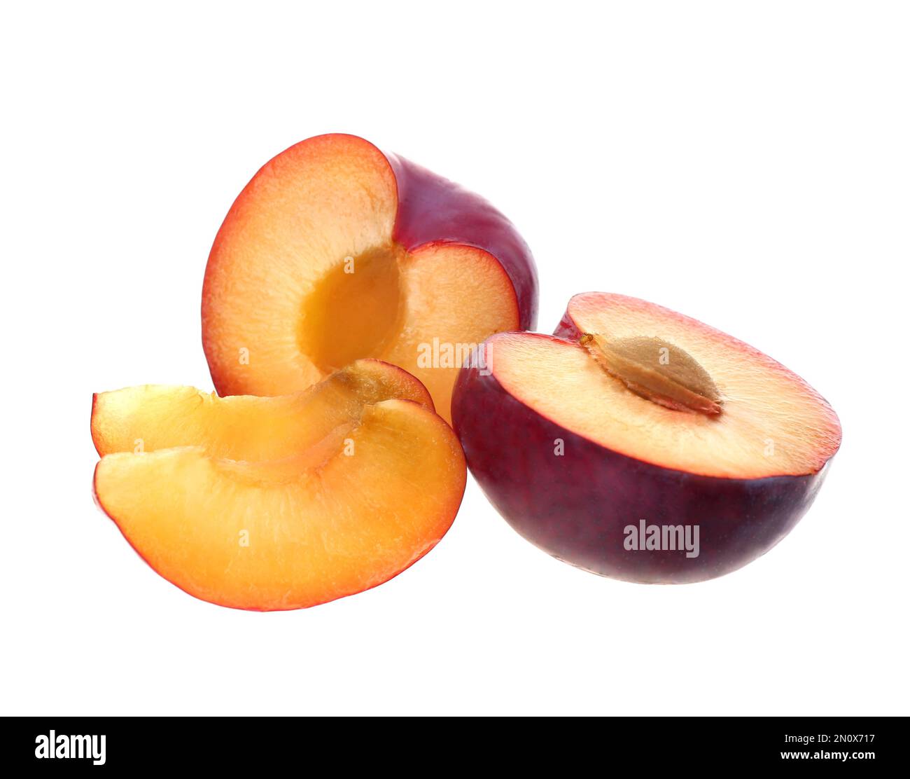 Cut fresh ripe plums isolated on white Stock Photo - Alamy