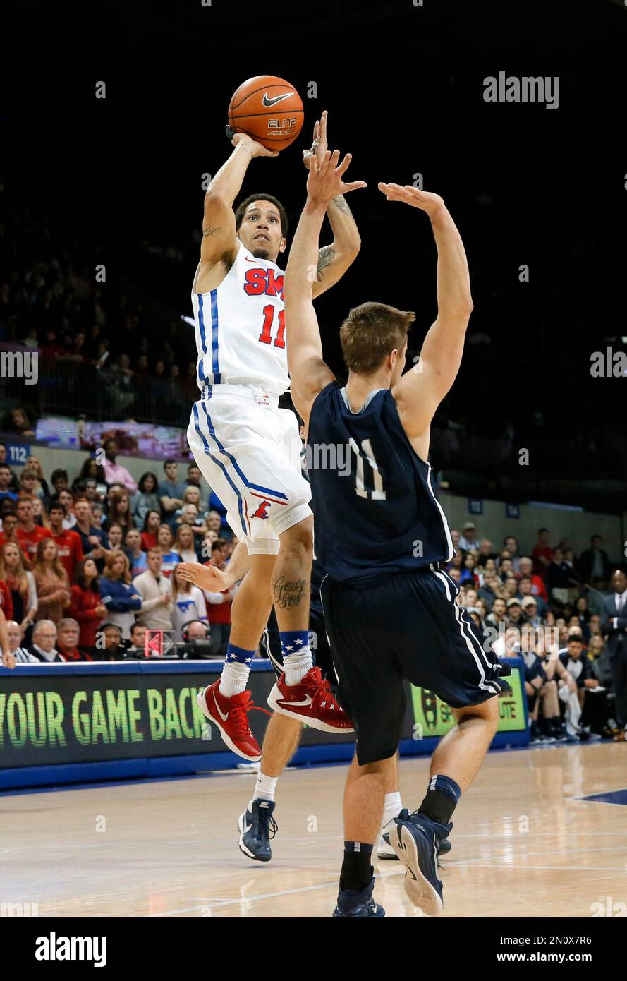 SMU guard Nic Moore attempts a shot over Yale guard Makai Mason (11 ...