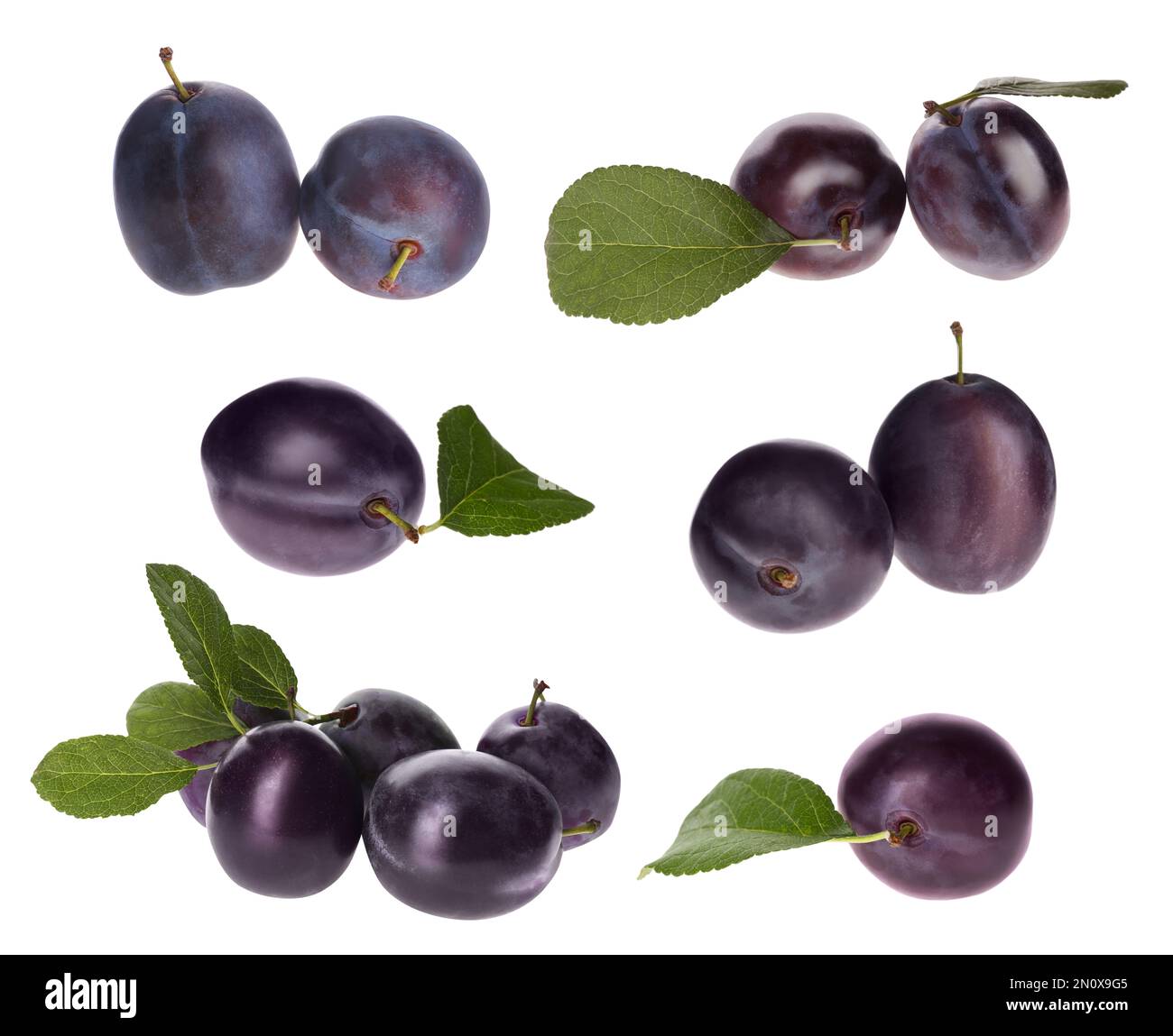 Set of fresh ripe plums on white background Stock Photo - Alamy