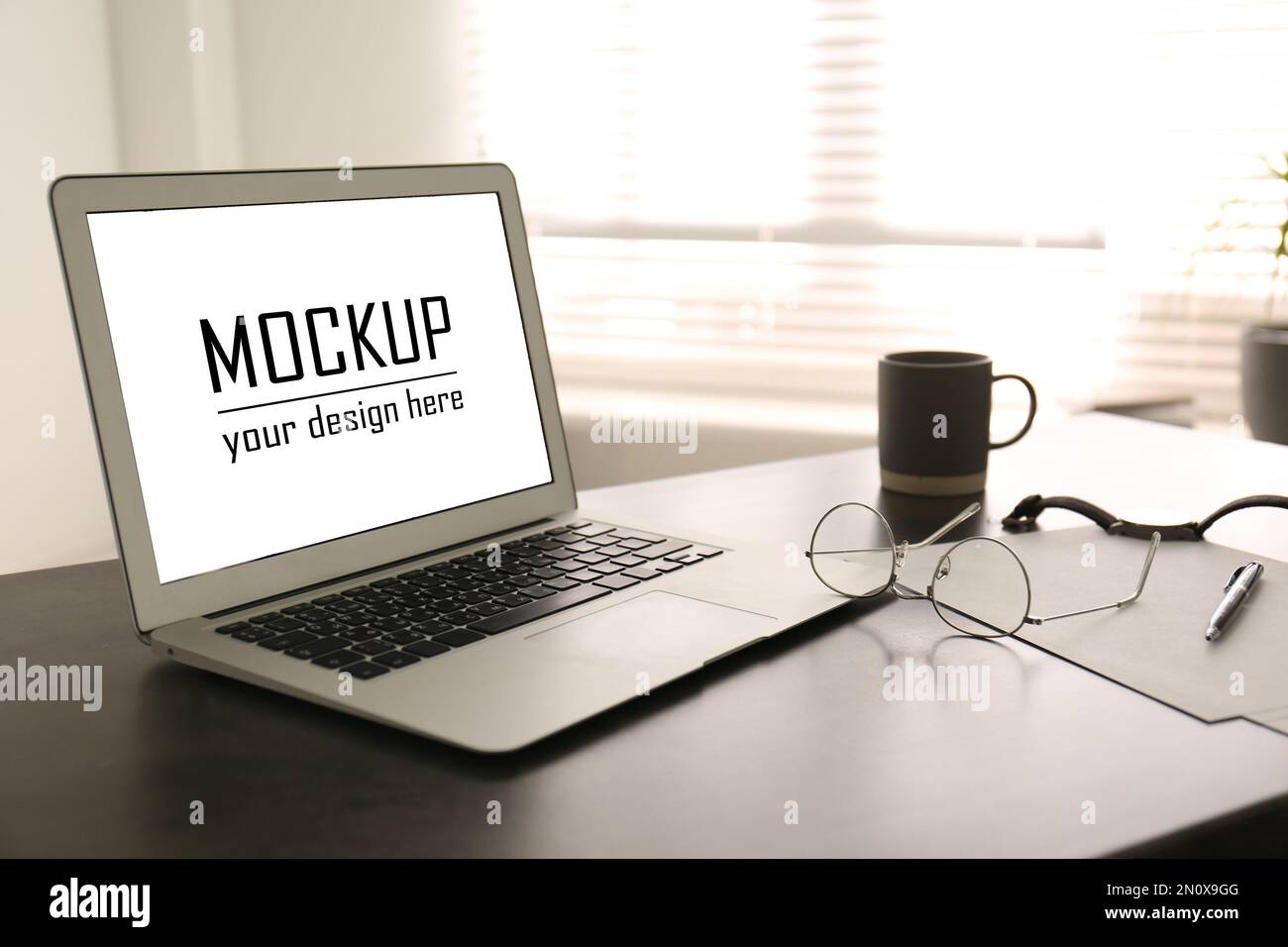 Modern laptop with text Mockup Your Design Here on screen Stock Photo ...