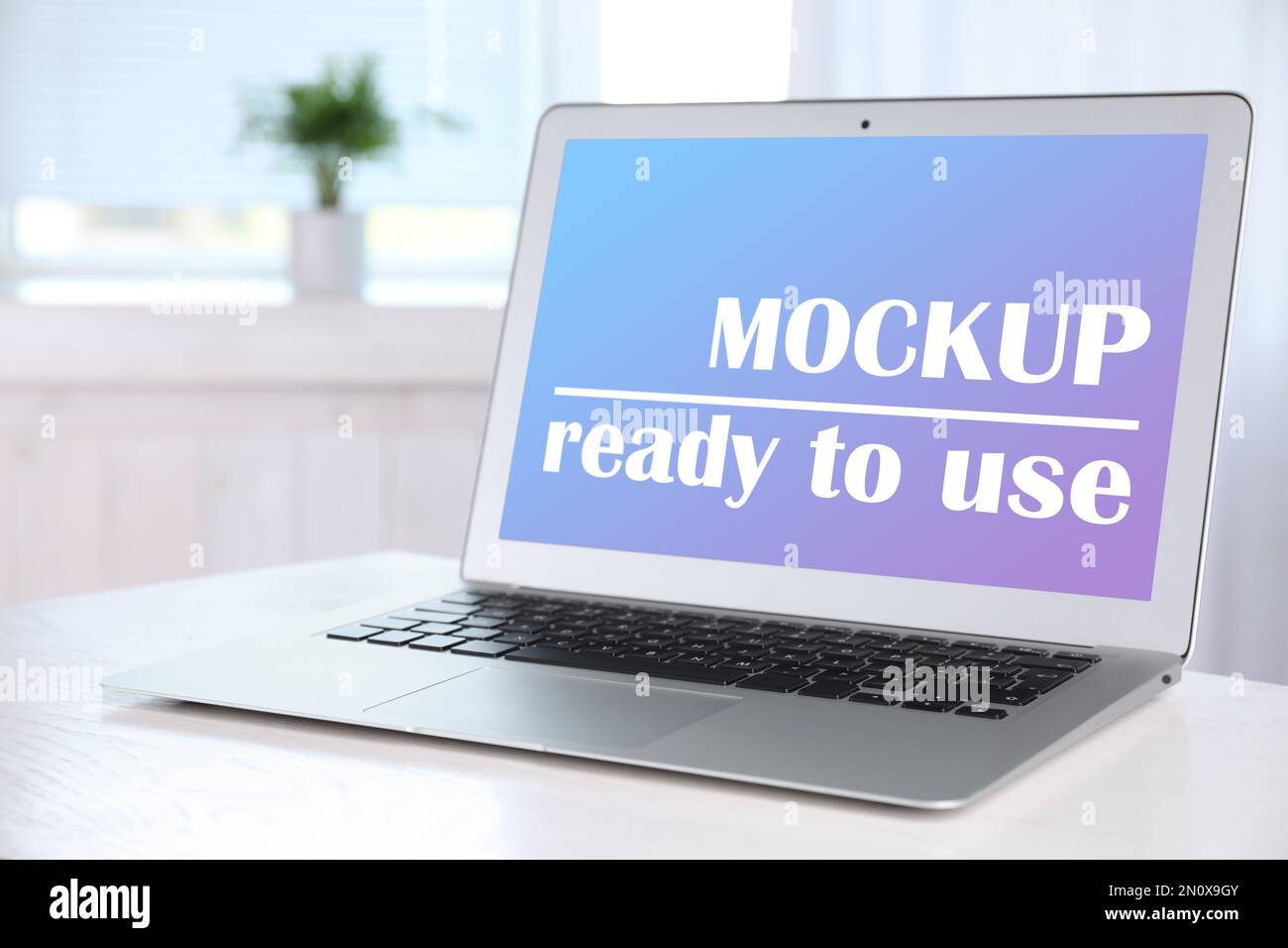 Modern laptop with text Mockup Ready To Use on screen Stock Photo - Alamy