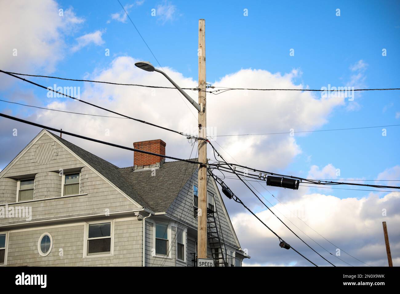Electric power lines in the clear blue sky Stock Photo - Alamy