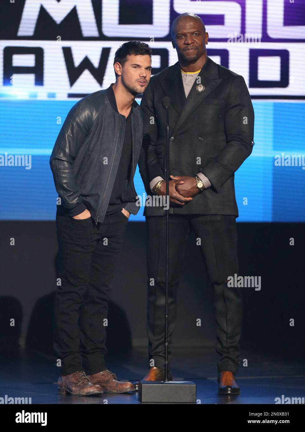 Taylor Lautner, left, and Terry Crews introduce a performance at the ...