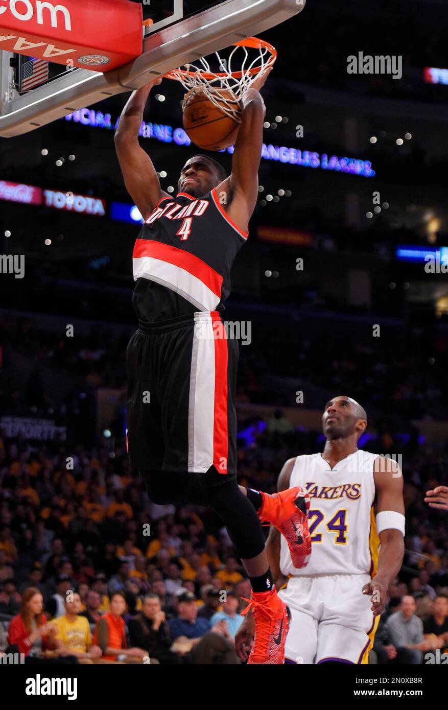 Portland Trail Blazers forward Maurice Harkless, left, dunks as Los ...