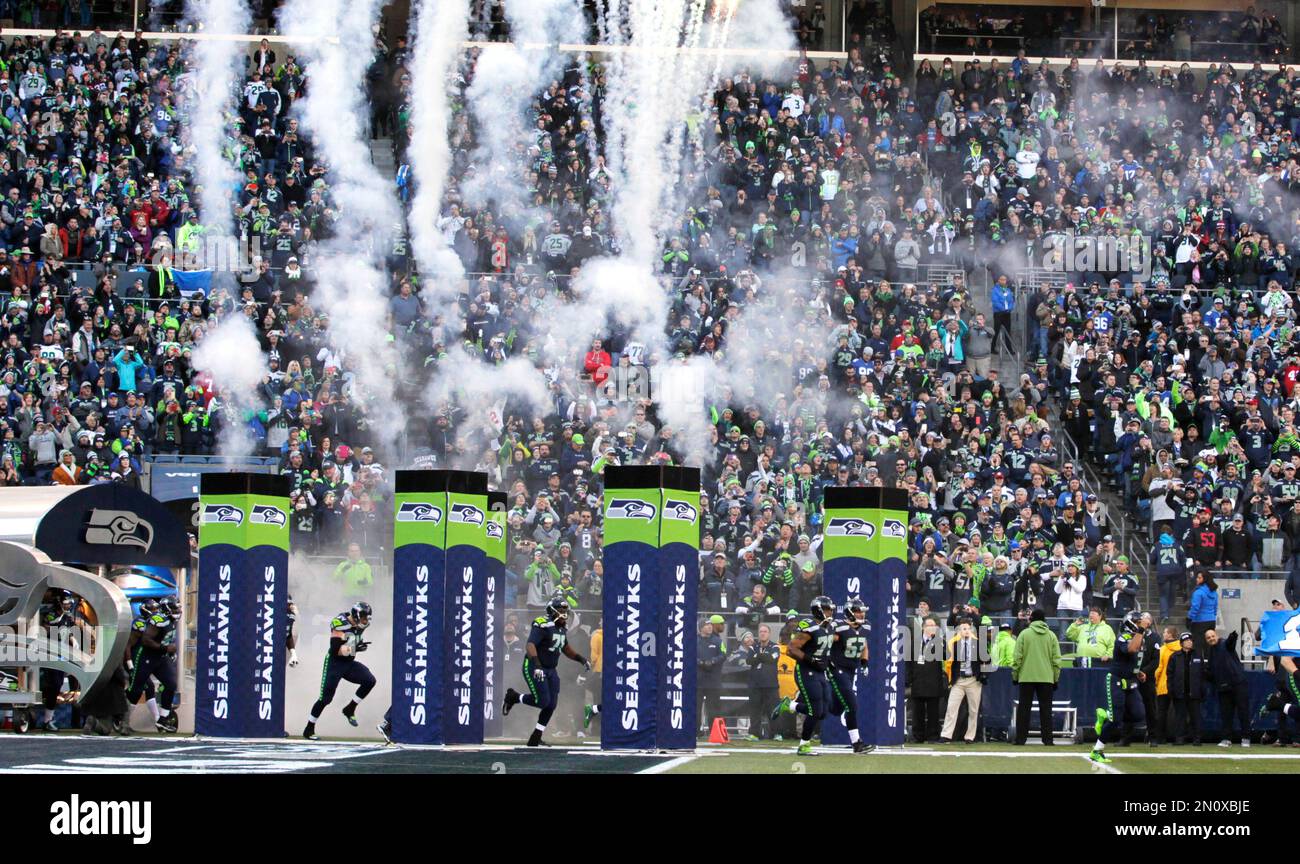 Seattle Seahawks players take the field as they run out of the tunnel ...