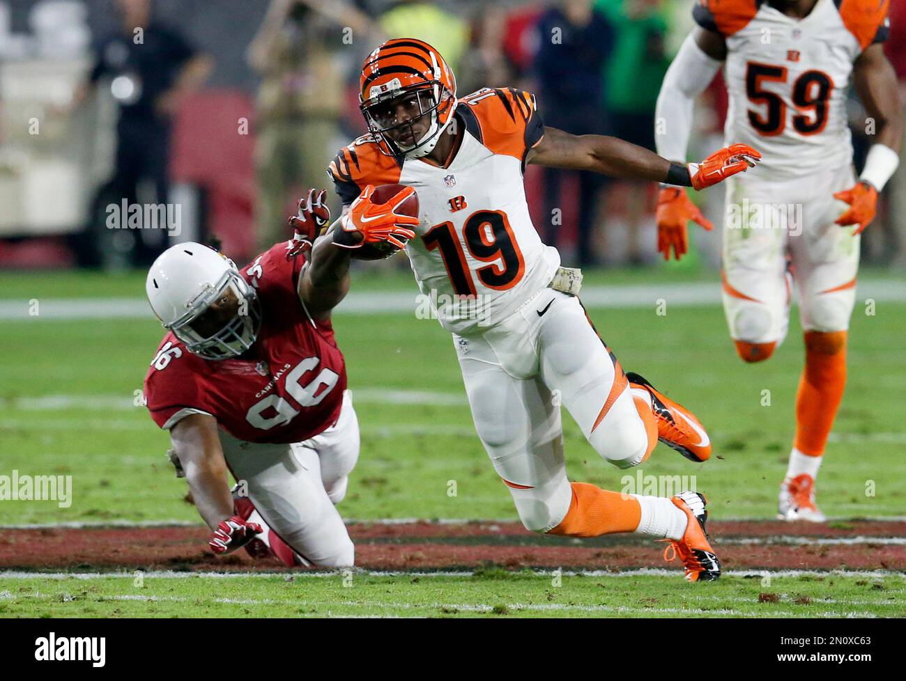 Cincinnati Bengals wide receiver Brandon Tate (19) slips past Arizona ...