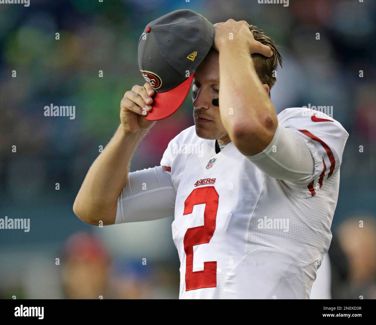 San Francisco 49ers quarterback Blaine Gabbert adjusts his cap on the ...
