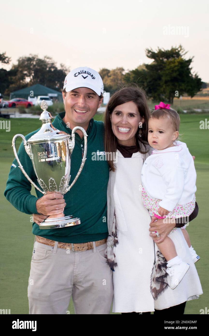 Kevin Kisner holds the RSM Classic trophy, and his wife Brittany Kisner ...