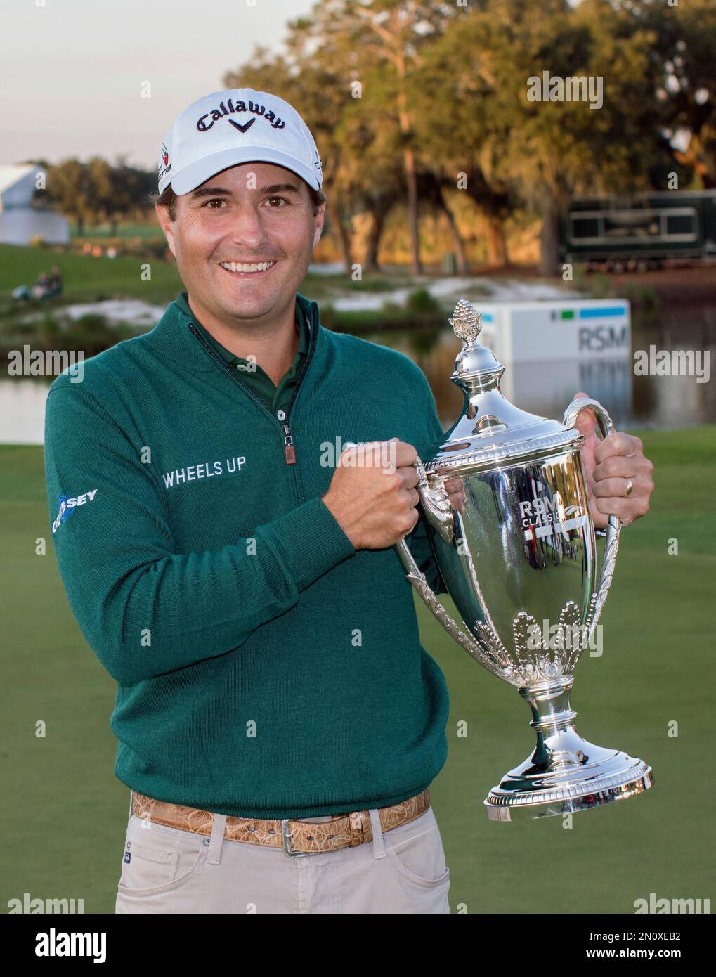 Kevin Kisner holds the RSM Classic trophy after his winning the final ...
