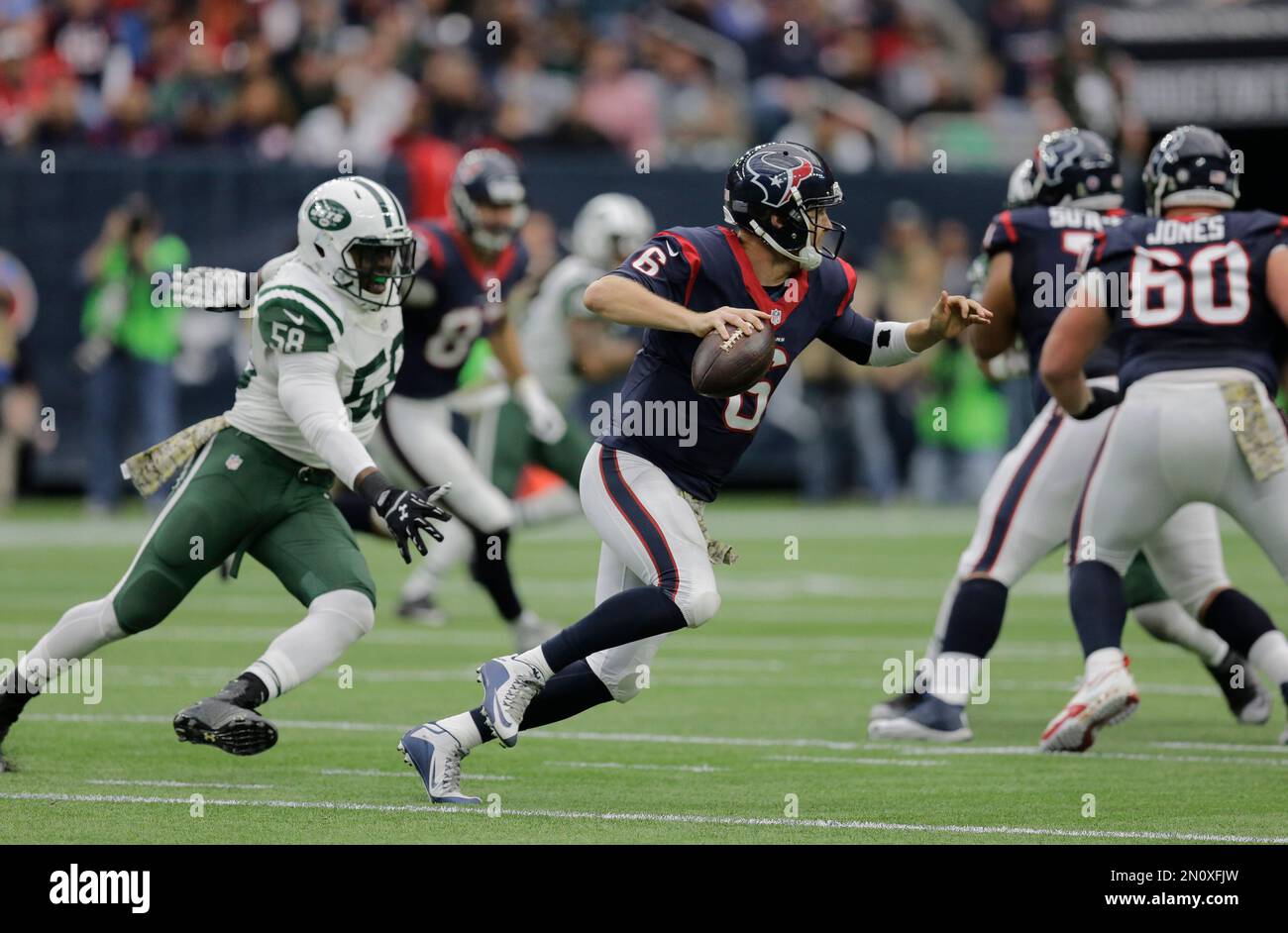 Houston Texans quarterback T.J. Yates (6) scrambles during the second ...