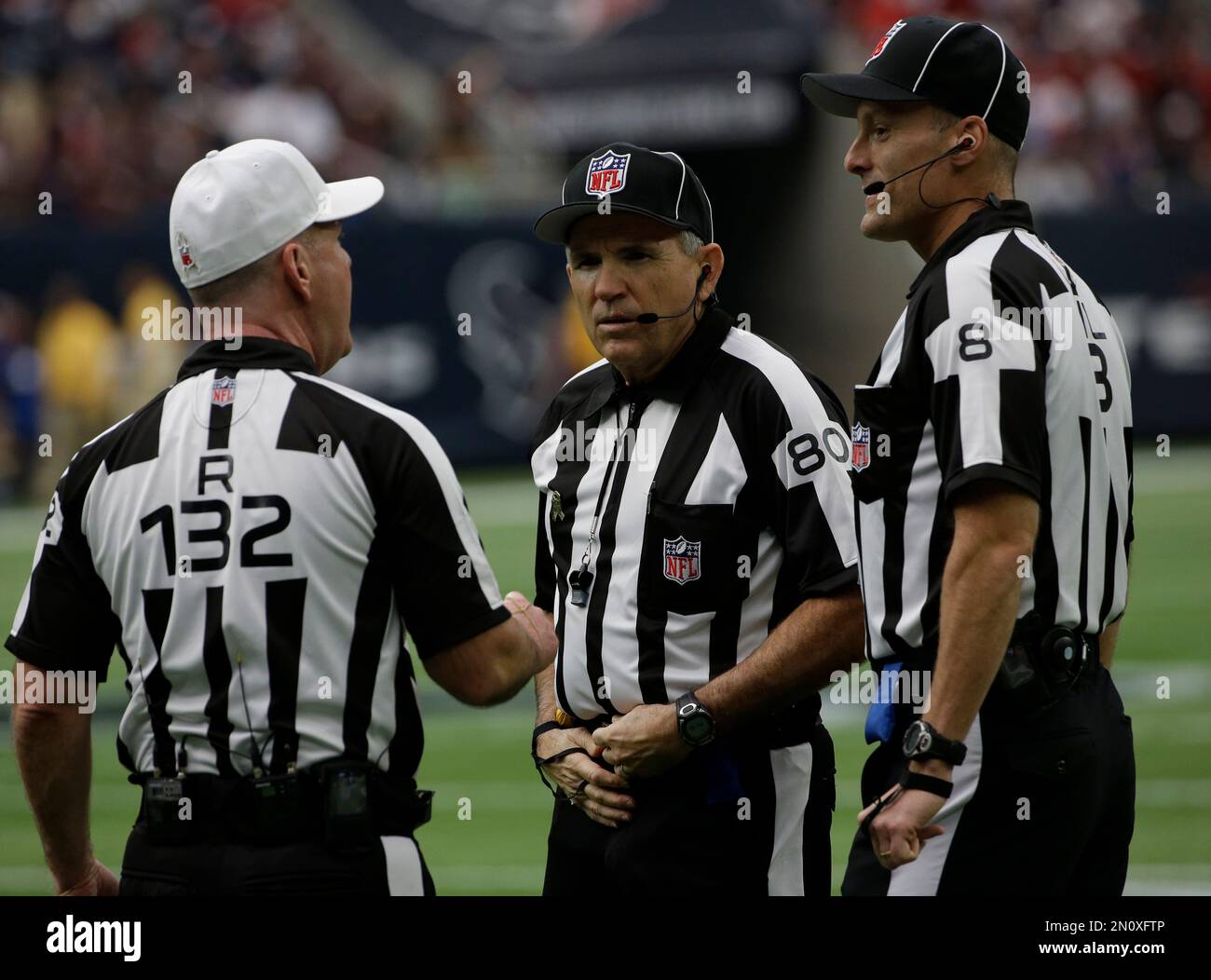 Referee John Parry (132) talks with members of his crew during the ...