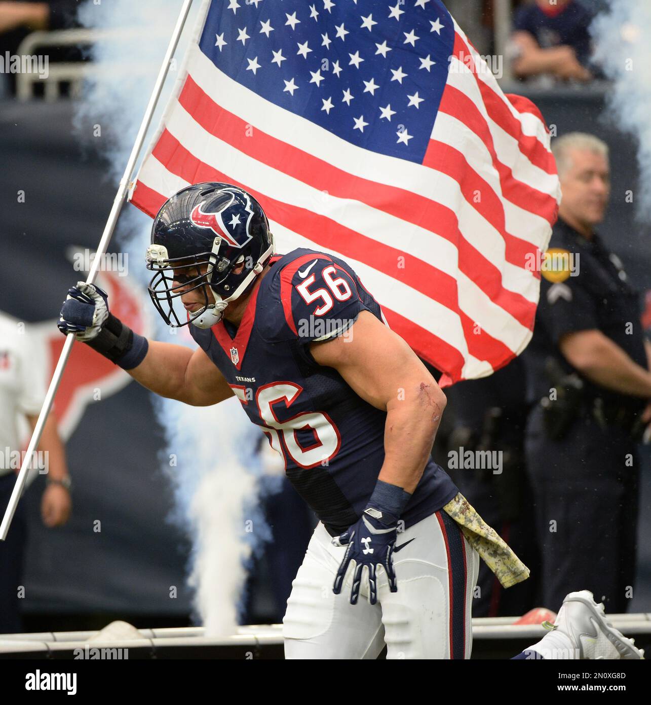 Houston Texans inside linebacker Brian Cushing (56) carries a flag ...