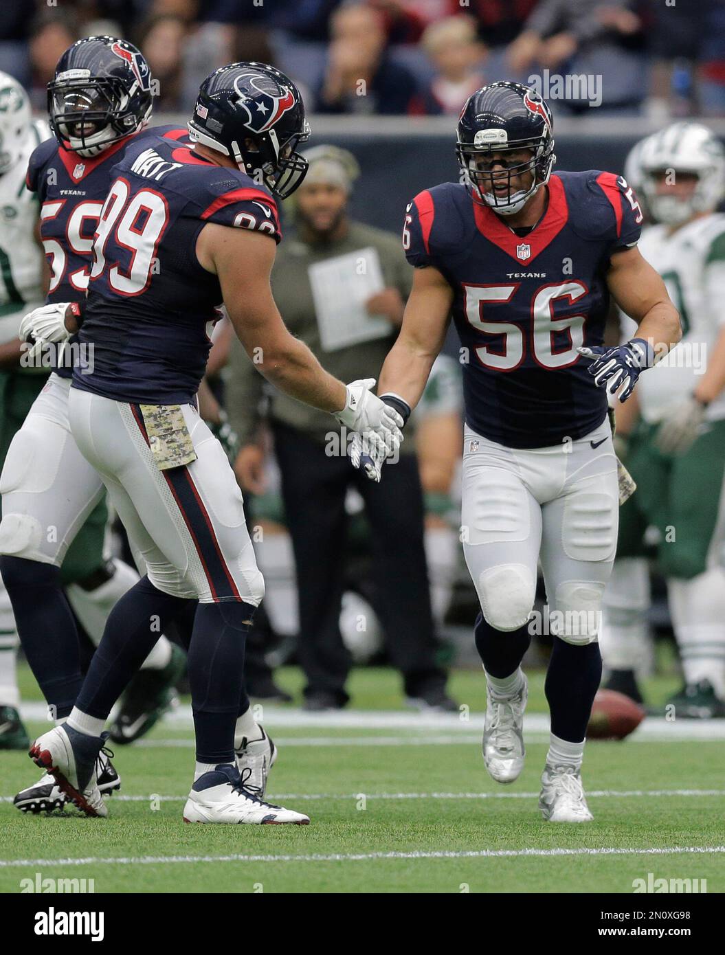 Houston Texans inside linebacker Brian Cushing (56) is in congratulated ...