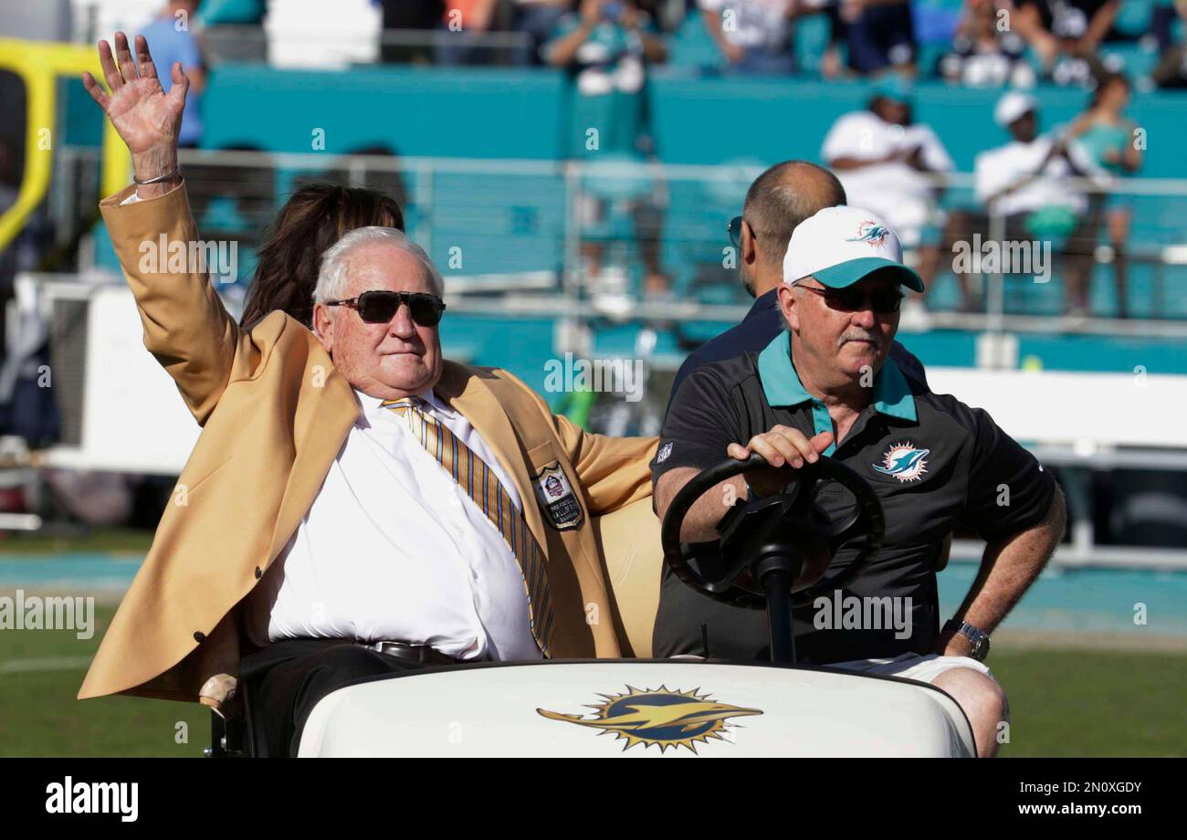 Former Miami Dolphins head coach Don Shula is driven to a podium to ...