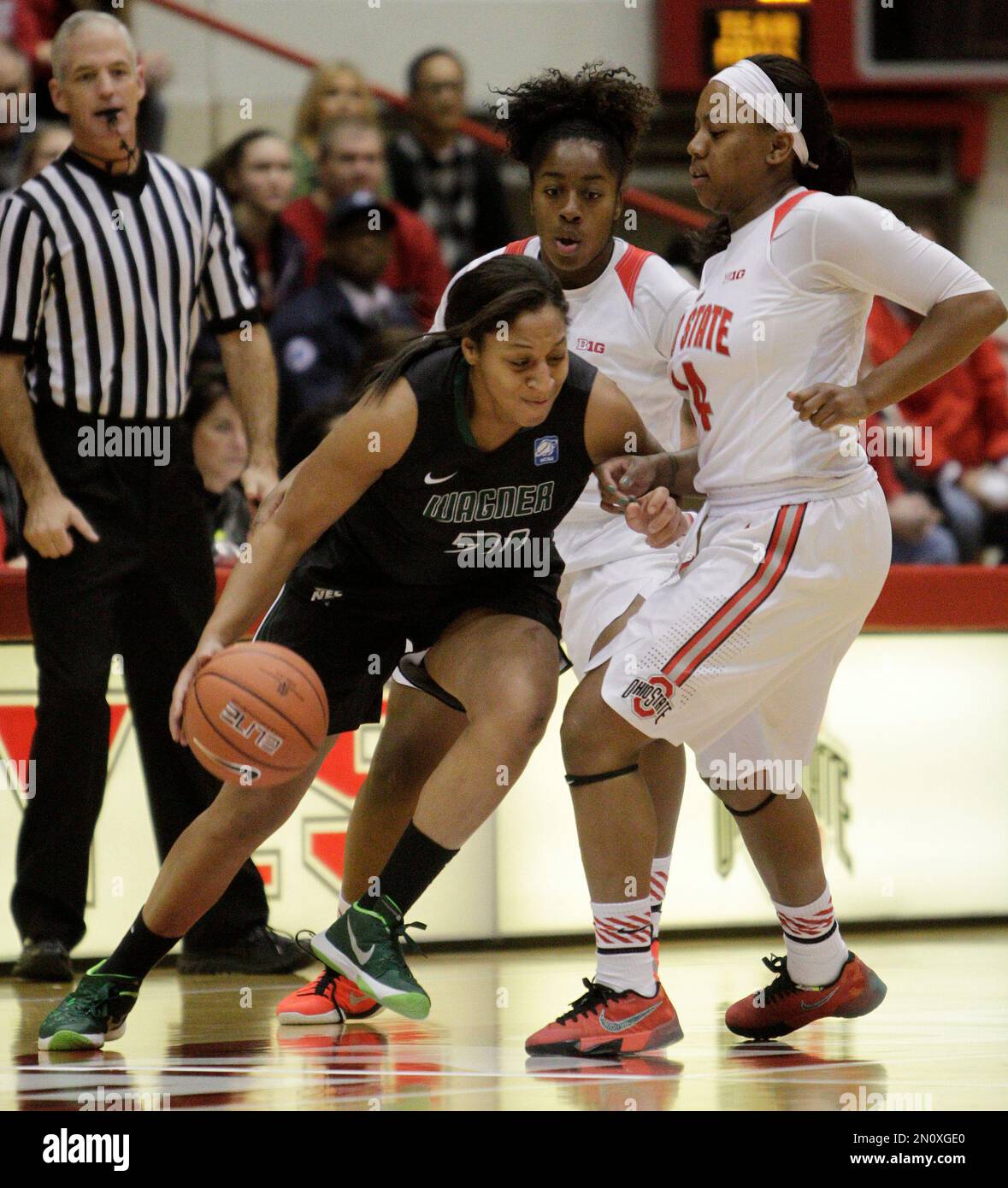 Wagner's Alexis Smith, front left, tries to dribble past Ohio State's ...
