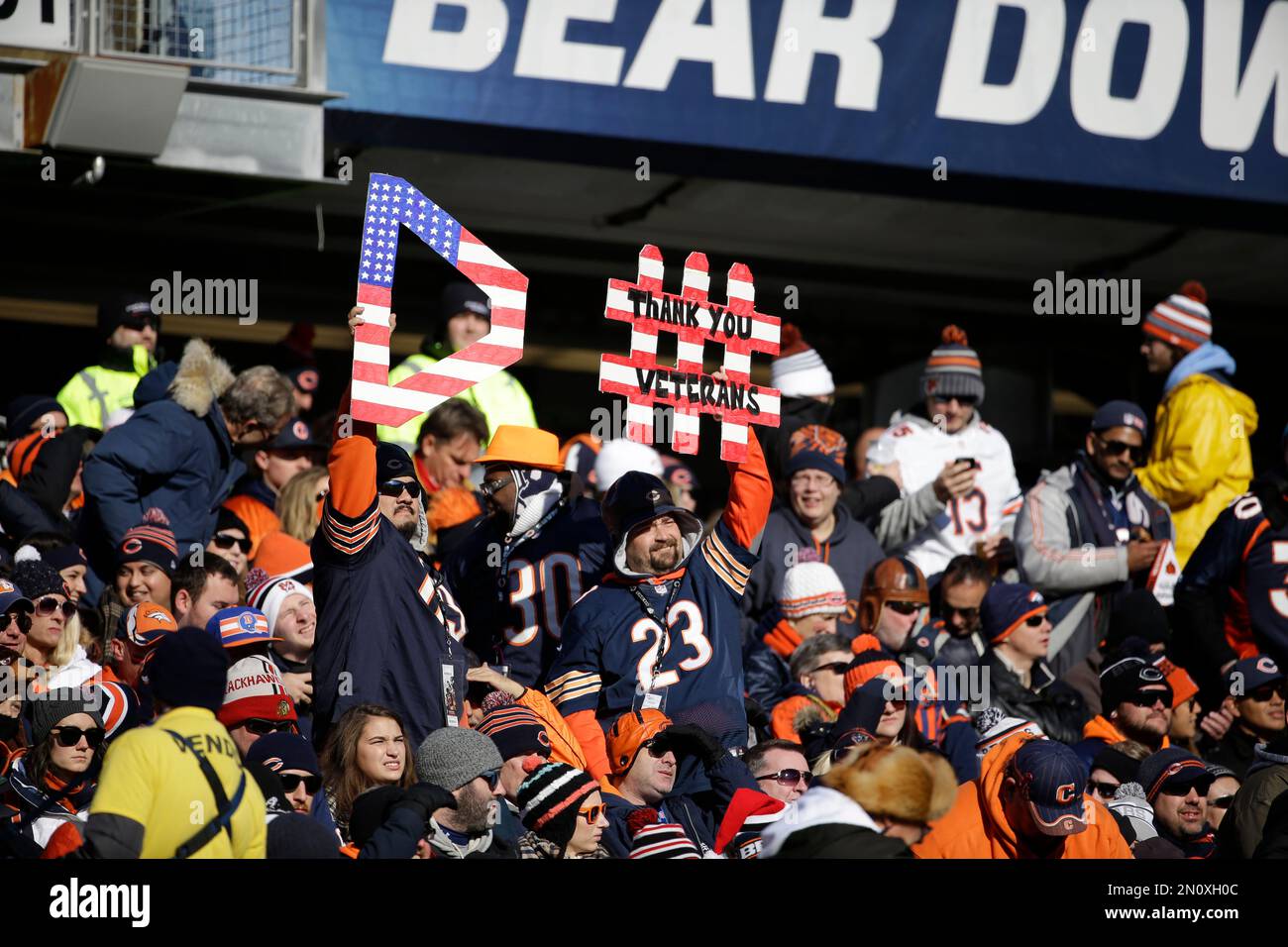 Chicago Bears fans hold up signs during the first half of an NFL ...