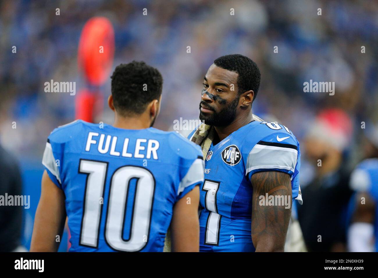 Detroit Lions wide receiver Calvin Johnson, right, talks with wide ...