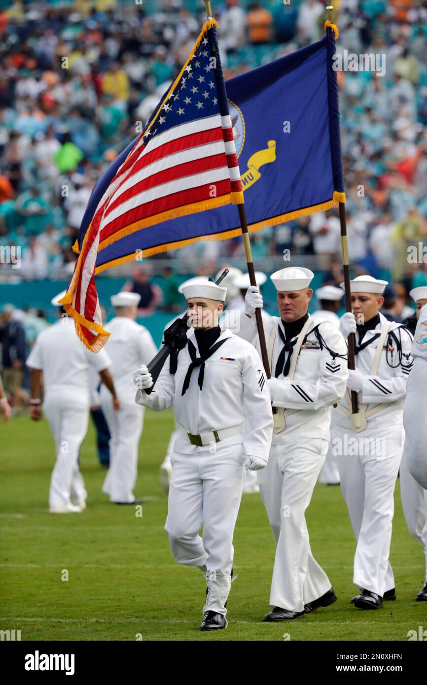 Midshipmen parade during the Salute to Ser between the Miami Dolphins ...
